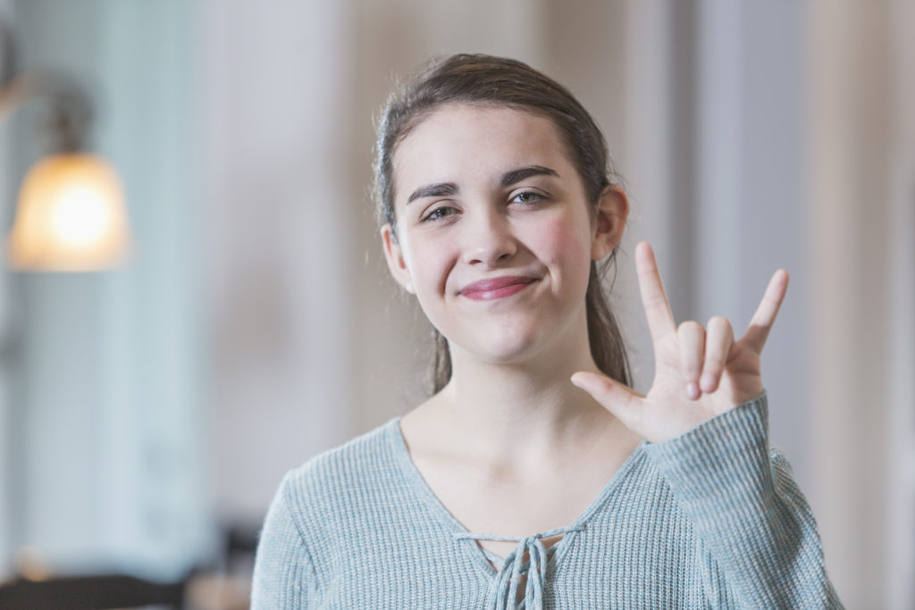 Teenage Girl Saying I Love You In Sign Language Ultratec